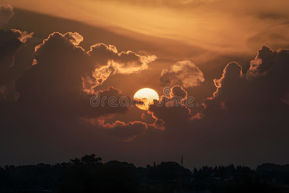 Sun Disk Peeks Out from Behind Dramatic Backlit Clouds Stock ...