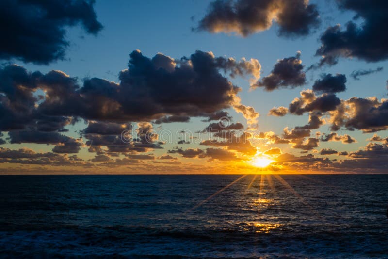 A sun disk with rays stock photo. Image of evening, seascape - 157754980