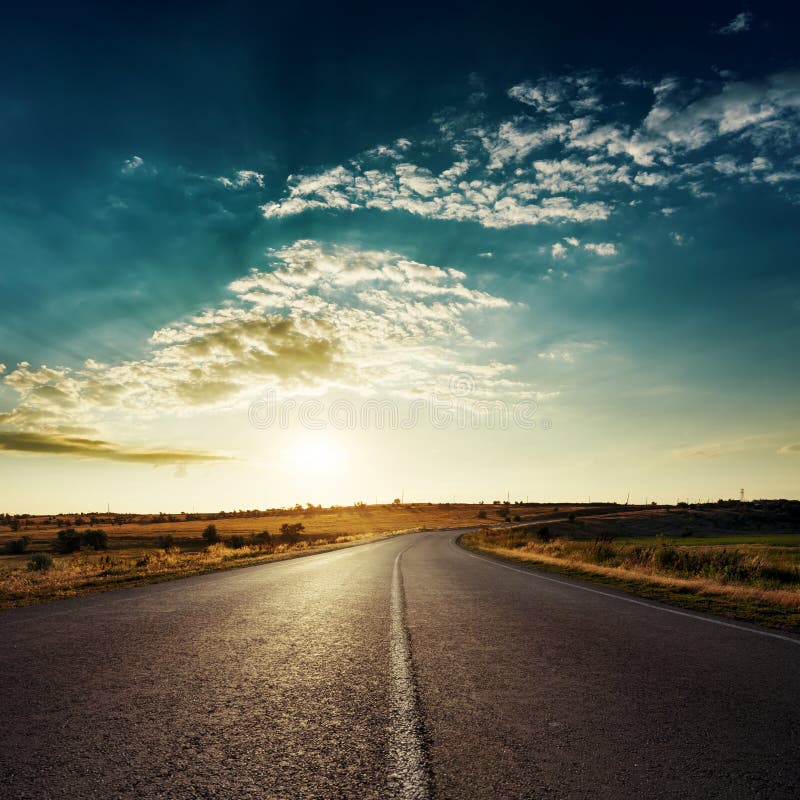 Sun in Dramatic Clouds Over Asphalt Road, Sunset Time Stock Image ...