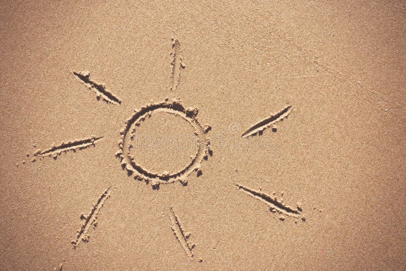 Sun drawing on beach sand. stock photo. Image of spain - 110920818