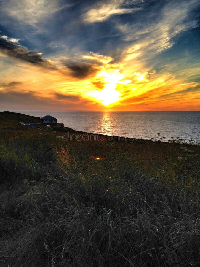The Sun is at the Edge of the World Stock Image - Image of cliff, local ...