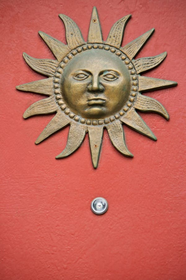 Sun face on a red door stock image. Image of entry, icon - 21422687