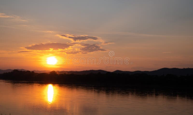 The Sun is Falling Behind the Mountain View the Beautiful River Stock ...