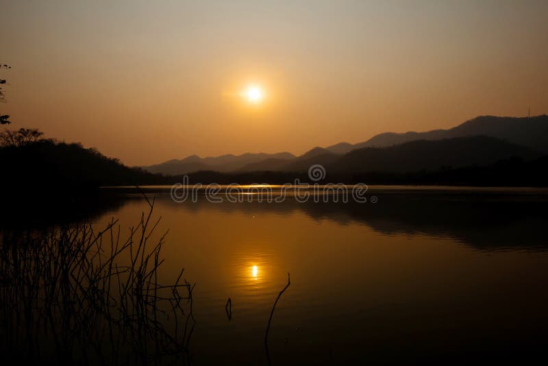 The Sun is Falling with Mountain View Stock Image - Image of reservoir ...