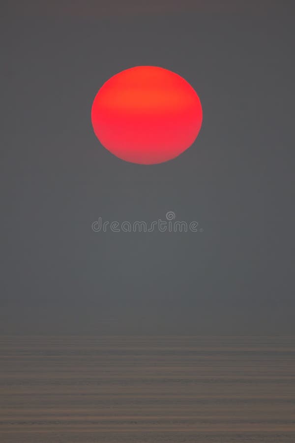 The Sun is Falling into the Sea. it is Colour Orang the Sky and the Sea ...