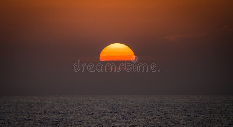 The Sun Falling in To the Sea. a Spectacular Golden Sunset Stock Image ...