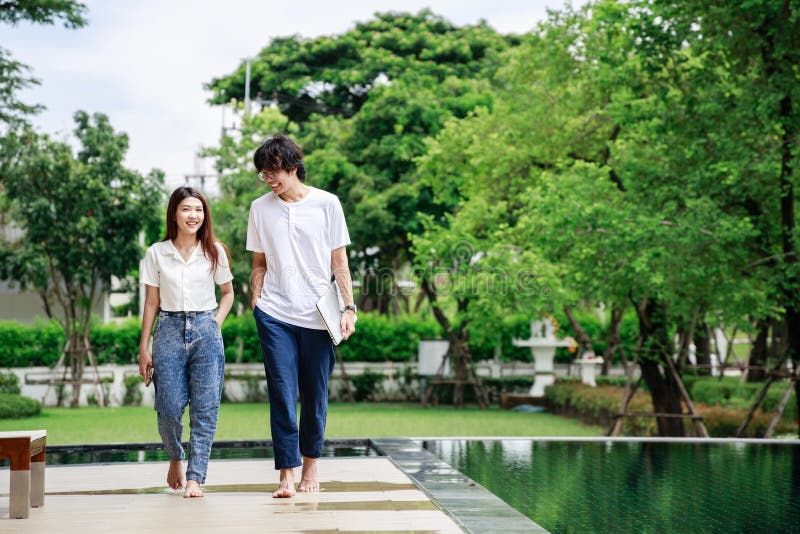 Sun, Fun, and Work, Happy Business Couple Balances Work and Play by the ...