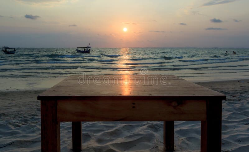 Sun Glade on Top of Wooden Table at Sunset with Seaview Background ...