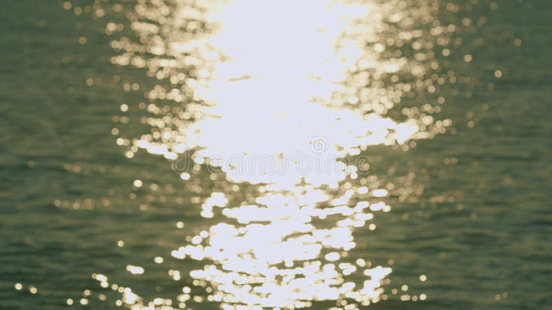 Sun Glare on the Surface of the Water. Ripples and Sun Glare at Day ...
