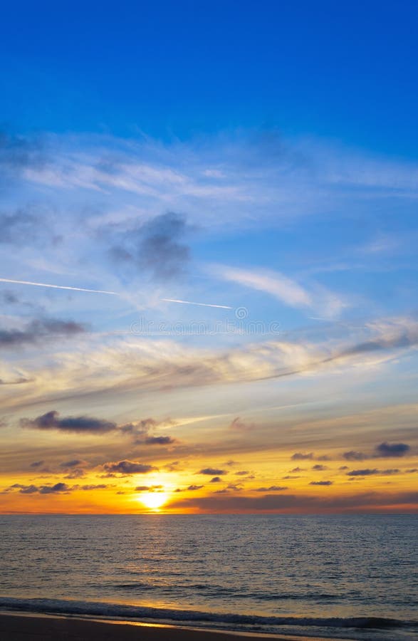 The Sun Going Below the Horizon of the Sea, Sunset on the Sea Coast ...