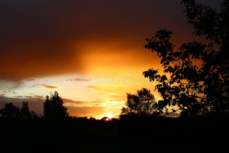 The sun is going down stock image. Image of reflection - 237575903