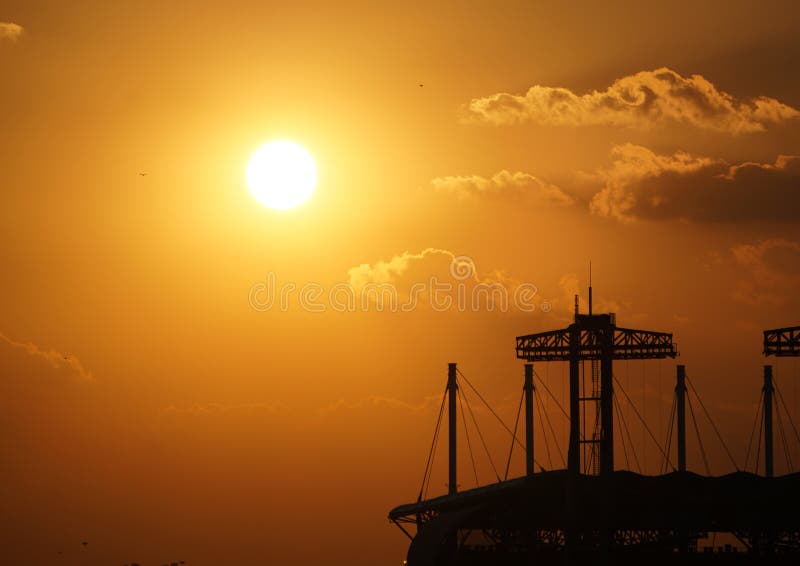 Sun in the Golden Moment and a Ship Shape Building Stock Photo - Image ...