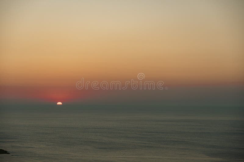 The Sun during Golden Sunset Just Above the Surface of the Sea Stock ...