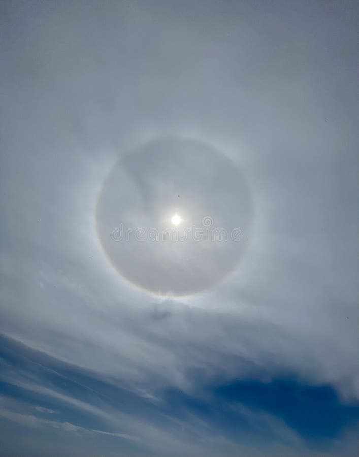 Sun with Halo Effect on Sky with Clouds Stock Photo - Image of ...