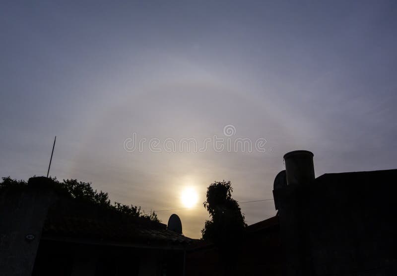 Sun and halo at sunset stock image. Image of orange - 194269911