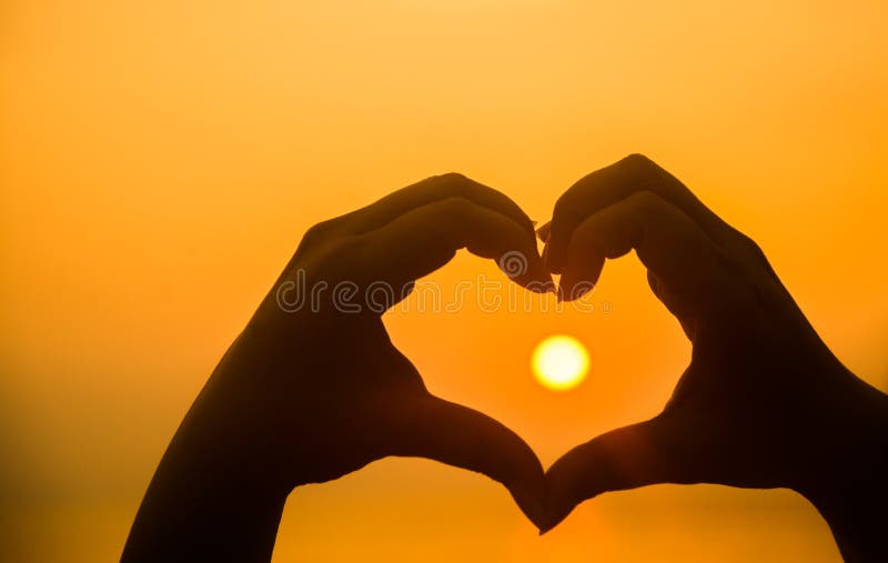 Sun in Hand Sunset Over the Beach Stock Photo - Image of ocean, heart ...