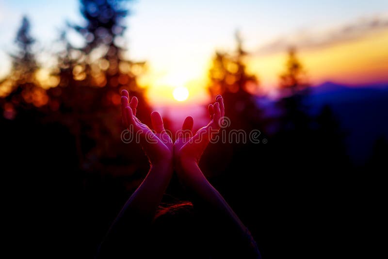 Sun in Hands. Sunset on the Background of Raised Hands. Stock Image ...