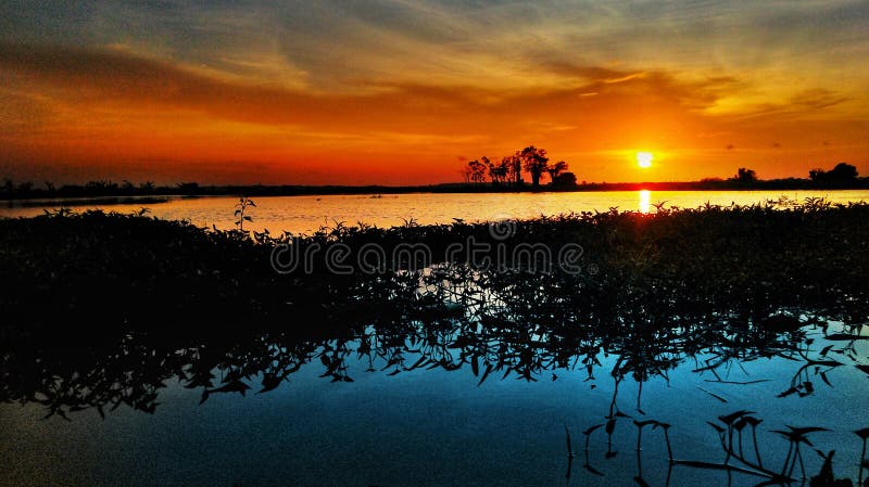 The sun has set stock photo. Image of reflection, sunset - 248632502