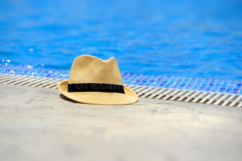 Sun Hat on the Edge of the Pool Stock Image - Image of sunhat ...