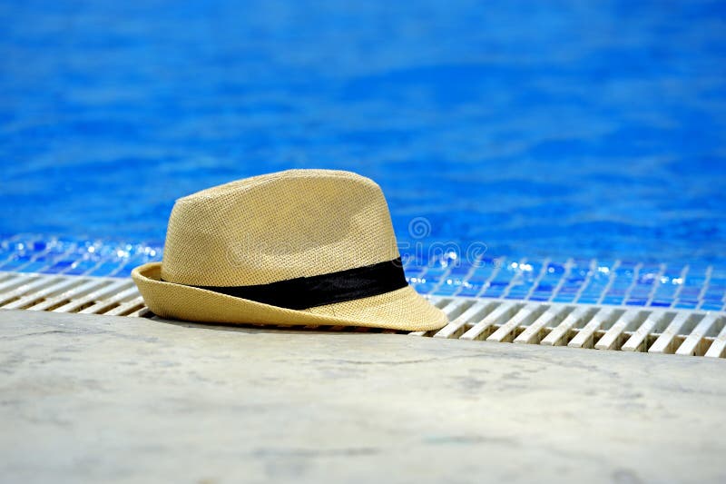 Sun Hat on the Edge of the Pool Stock Photo - Image of rest, blue: 56078376
