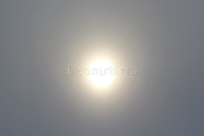 The Sun In The Haze Against The Blue Sky. Defocused Background For ...