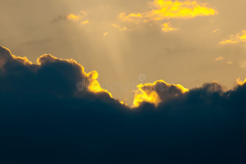 Sun Hidden Behind Clouds at Sunset Stock Photo - Image of cloudy, lines ...