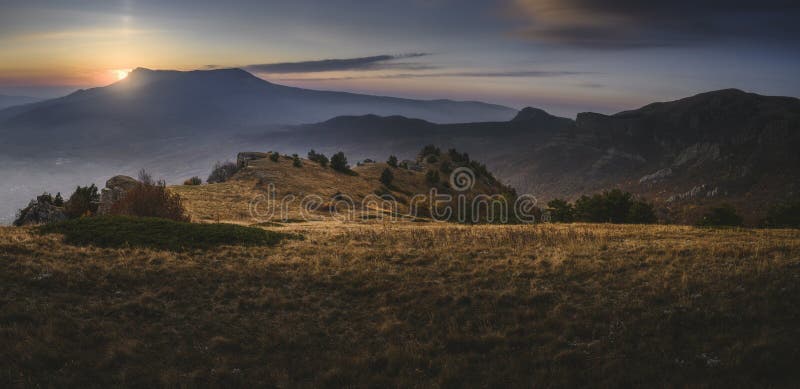 Sun Hides Behind the Mountains Stock Image - Image of park, foreground ...