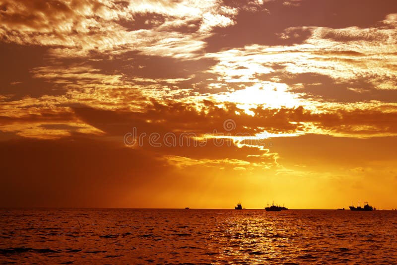 Sun hiding stock photo. Image of yellow, calm, tropical - 22065596