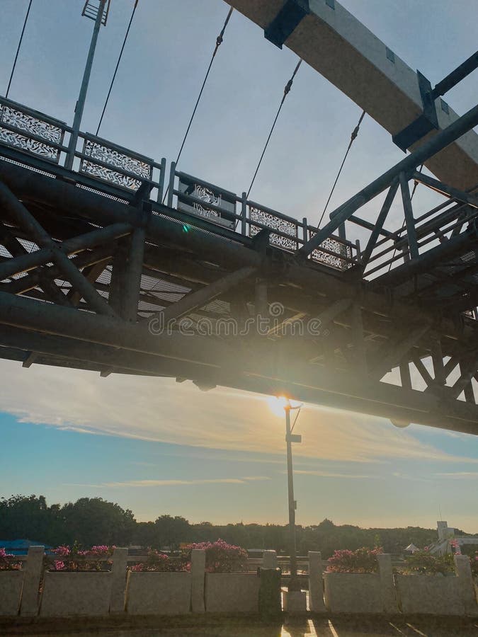 The Sun is Hiding Behind the Bridge Stock Photo - Image of beautiful ...