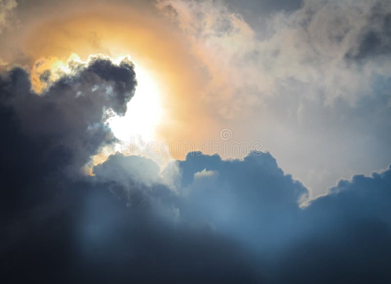 The Sun Hiding Behind the Clouds Stock Photo - Image of high, deep ...