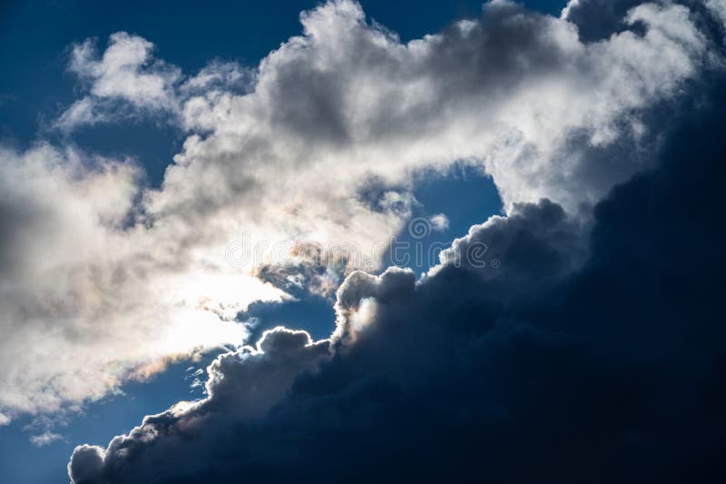 Sun Hiding Behind Dramatic Clouds.. Stock Image - Image of cloud ...