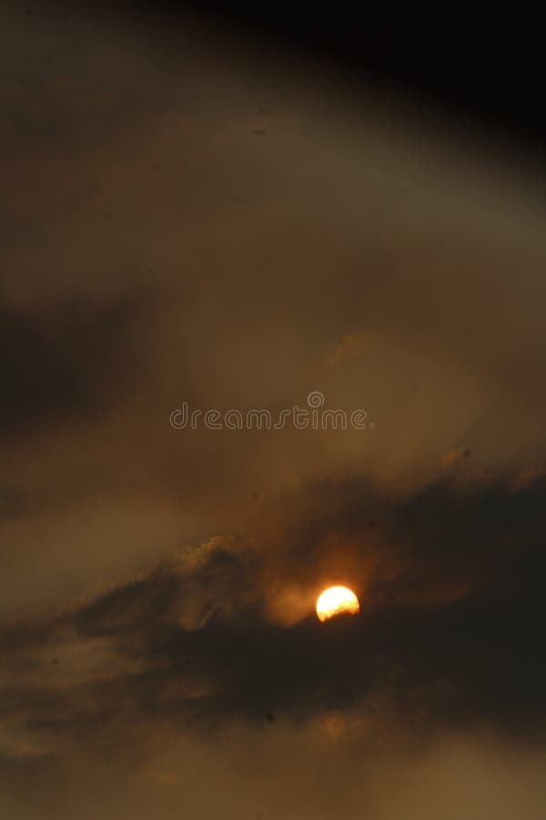 Sun Hiding in the Clouds stock photo. Image of awesome - 152600066