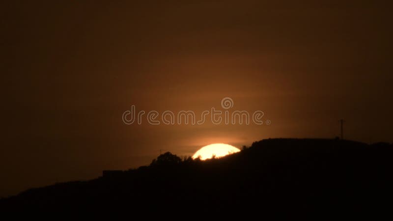 Sun Hiding in a Mountain at Sunset Time Lapse Stock Footage - Video of ...