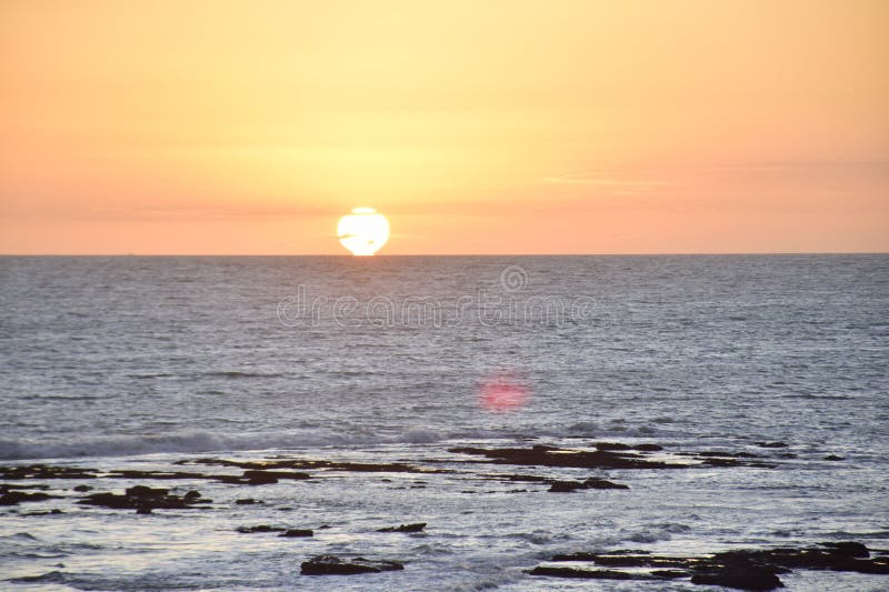 The Sun is on the Horizon at Sunset. Cadiz Stock Image - Image of wave ...