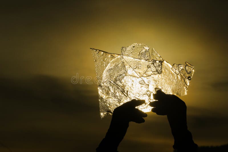 Sun and ice stock image. Image of holding, light, piece - 235344815