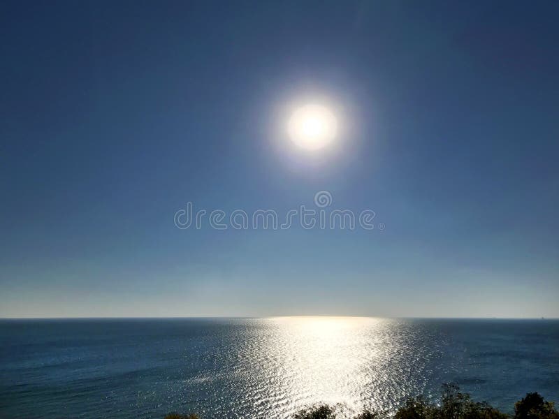 The Sun is at Its Zenith Above the Sea. Stock Image - Image of ...
