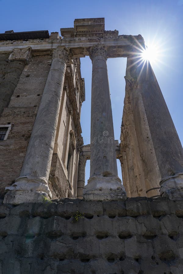 The Sun is Just Passing the Columns of Antoninus and Faustina Temple in ...