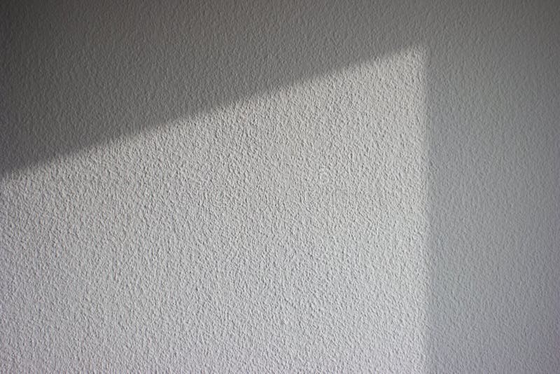 Sun Light Casting Angular Shadow on Gray Interior Textured Wall Stock ...