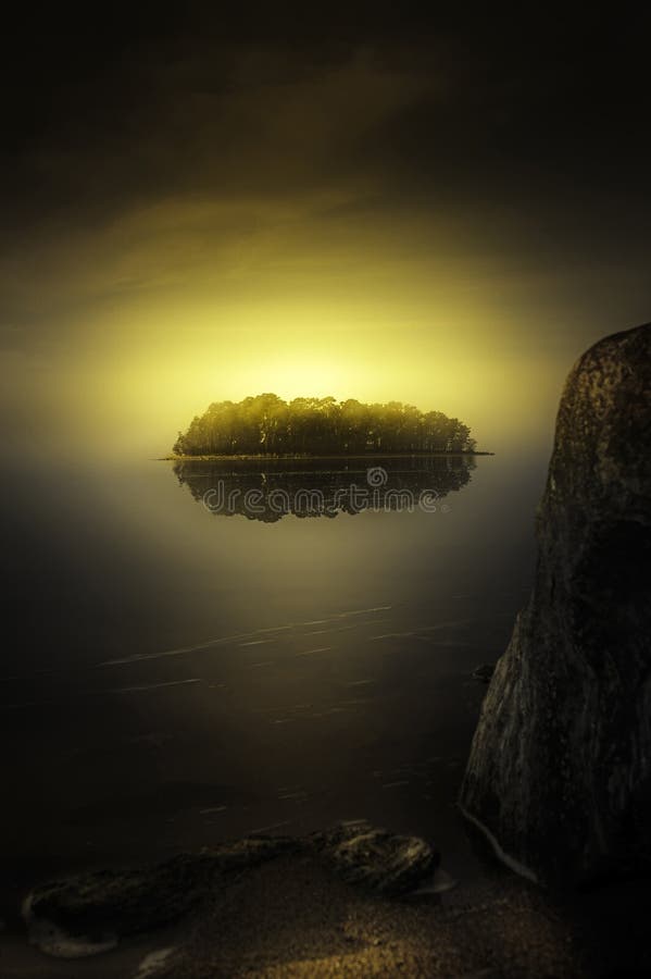 The Sun Lighting Up the Sky Behind the Island Stock Photo - Image of ...