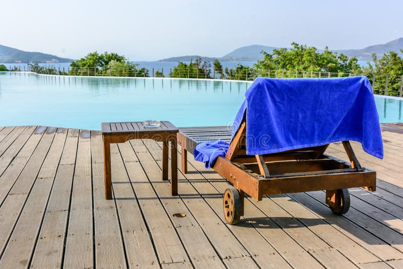 Sun Lounger and Coffee Table by the Pool Stock Photo - Image of ...