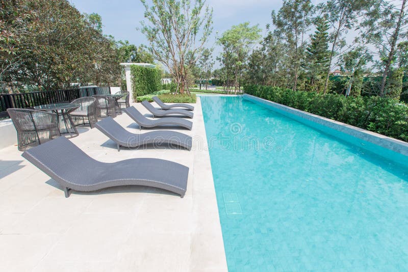 Sun Loungers and Beautiful Swimming Pool Stock Image - Image of chair ...