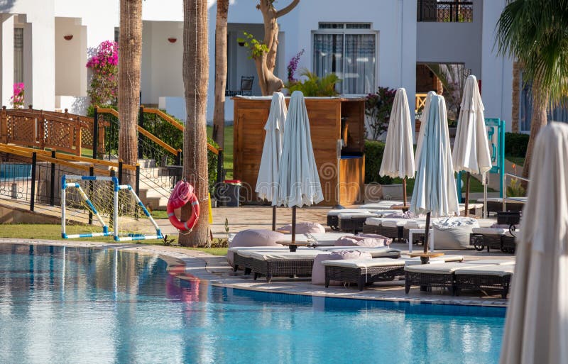 Sun Loungers by the Pool at the Resort Stock Photo - Image of swimming ...