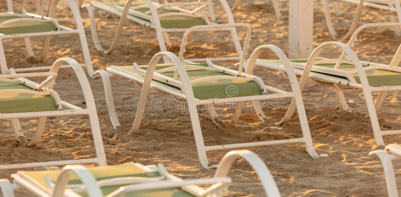 Sun Loungers on the Sandy Beach at Sunset Stock Photo - Image of ...