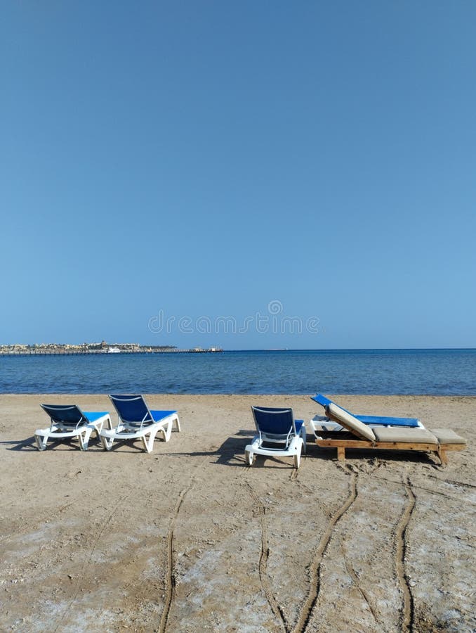 Sun Loungers Stand on a Deserted Beach, an Empty Beach Coast without ...