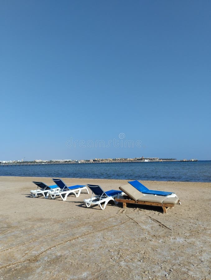Sun Loungers Stand on a Deserted Beach, an Empty Beach Coast without ...