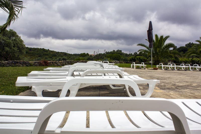 Sun Loungers beside Swimming Pool Stock Image - Image of comfort ...