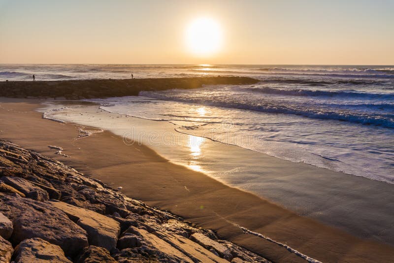 The Sun is Low on the Horizon, Casting a Warm Golden Glow Over the ...