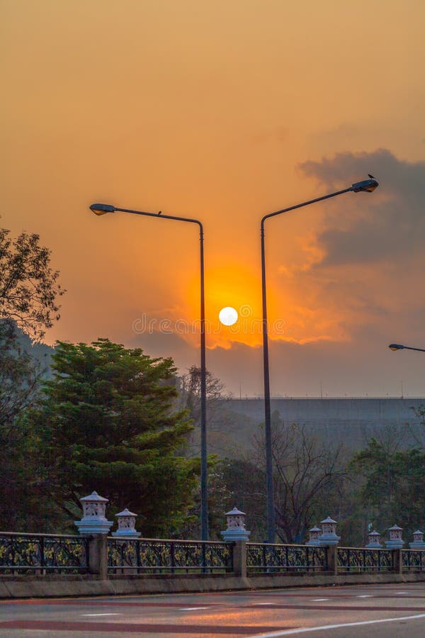 Sun in the Middle of Light Posts Stock Photo - Image of flower, water ...