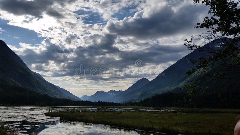 Sun between Mountains stock image. Image of hidden, dusk - 71999791