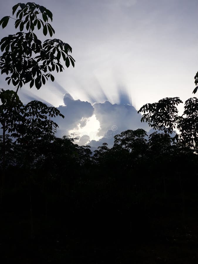 The Sun, Obscured by Dark Clouds, Casts a Dim Light. Stock Photo ...